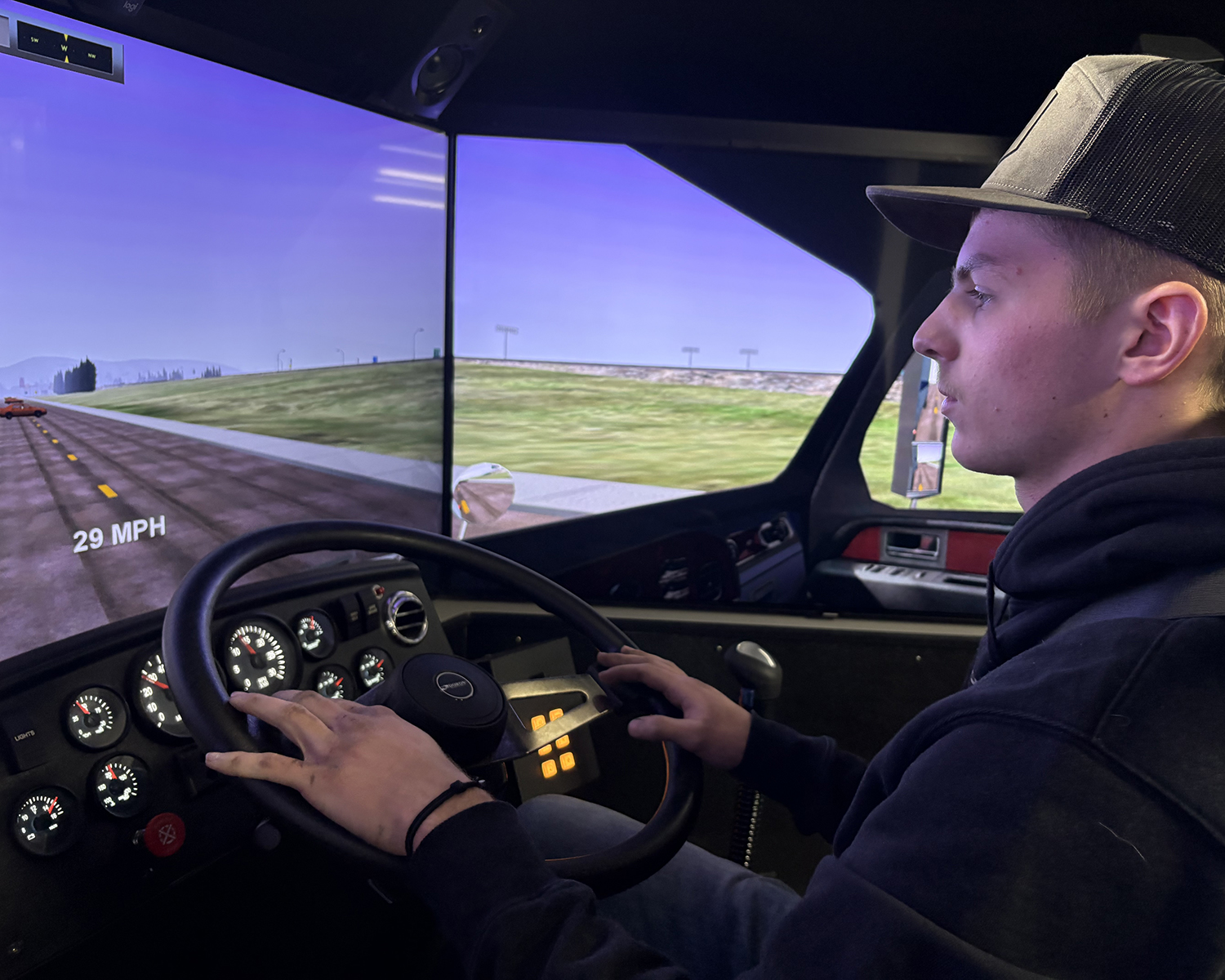 Students try their hand driving virtual tractor trailers as CTE ...
